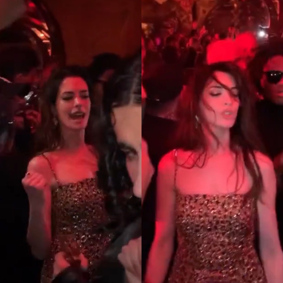 Anne Hathaway se joga na pista em after party da Valentino, durante a ...